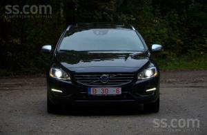 Black Volvo V60 2013 in Riga, with an engine capacity of 2.40 L and mileage of 304 thousand km for 7990 €, photo 6 on AUTOMOTO.COM.LV