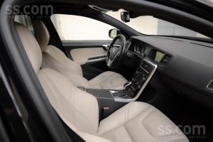 Black Volvo V60 2013 in Jelgava, with an engine capacity of 2.40 L and mileage of 192 thousand km for 10900 €, photo 20 on AUTOMOTO.COM.LV
