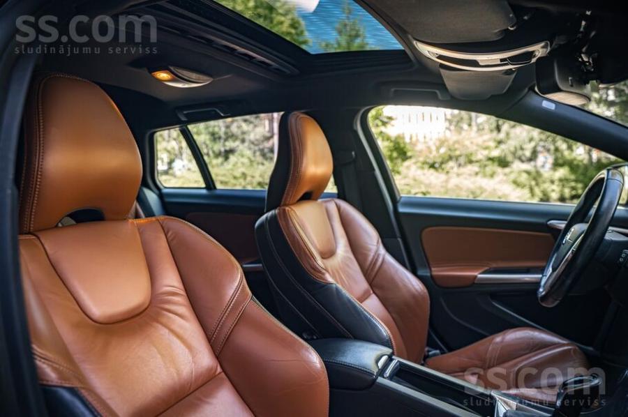 Black Volvo V60 2013 in Riga, with an engine capacity of 1.60 L and mileage of 303 thousand km for 4590 €, photo 10 on AUTOMOTO.COM.LV