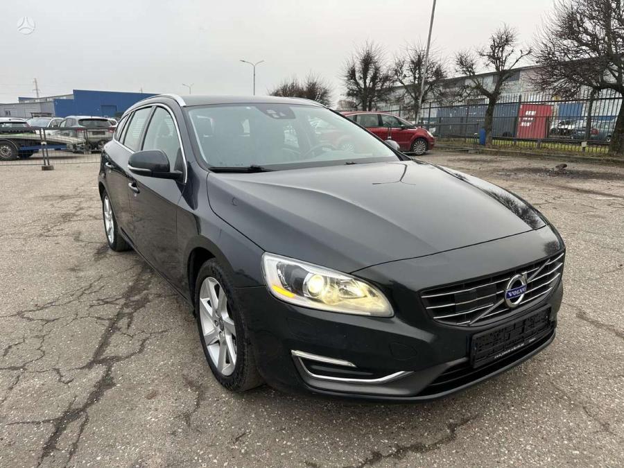 Black Volvo V60 2014 in Marijampole, with an engine capacity of 1.56 L and mileage of 260 thousand km for 6350 €, photo 1 on AUTOMOTO.COM.LV
