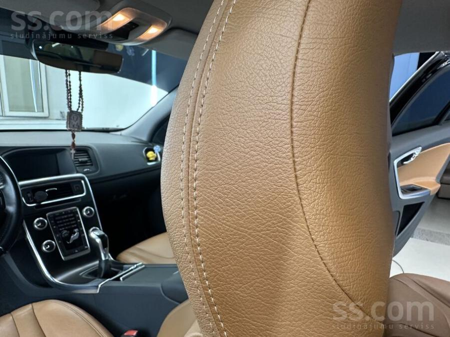 Black Volvo V60 2014 in Riga, with an engine capacity of 2.00 L and mileage of 254 thousand km for 7750 €, photo 26 on AUTOMOTO.COM.LV