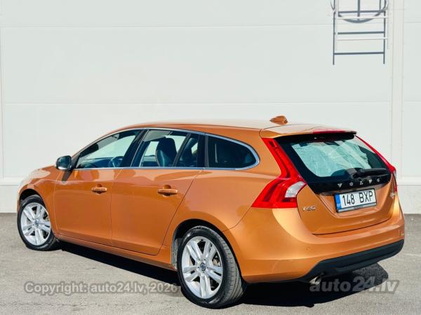 Orange Volvo V60 2012 in Tallinn, with an engine capacity of 2.00 L and mileage of 318 thousand km for 6390 €, photo 4 on AUTOMOTO.COM.LV