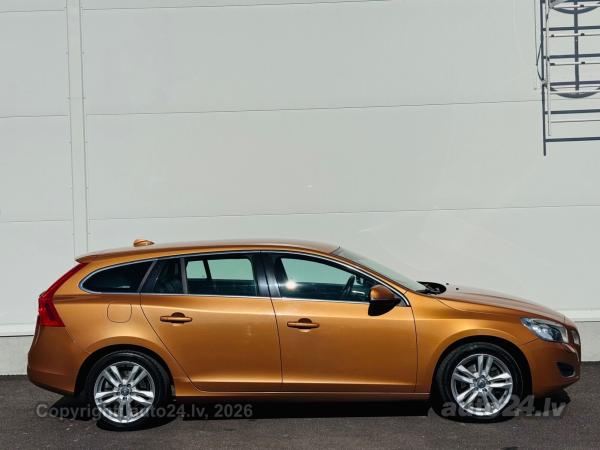 Orange Volvo V60 2012 in Tallinn, with an engine capacity of 2.00 L and mileage of 318 thousand km for 6390 €, photo 7 on AUTOMOTO.COM.LV