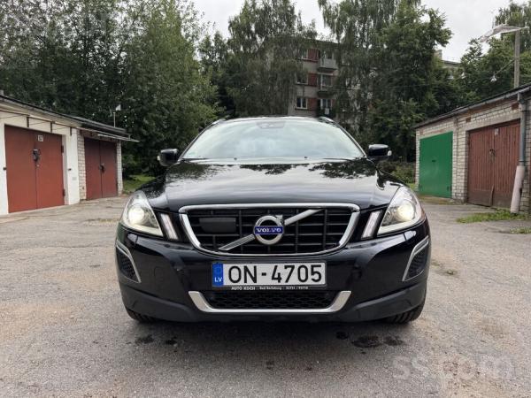 Black Volvo XC60 2012 in Riga, with an engine capacity of 2.40 L and mileage of 306 thousand km for 10300 €, photo 1 on AUTOMOTO.COM.LV