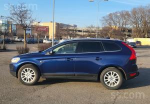 Blue Volvo XC60 2011 in Riga, with an engine capacity of 2.40 L and mileage of 286 thousand km for 8990 €, photo 5 on AUTOMOTO.COM.LV