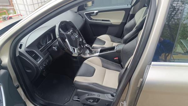 Brown Volvo XC60 2015 in Alytus, with an engine capacity of 2.00 L and mileage of 303 thousand km for 10499 €, photo 5 on AUTOMOTO.COM.LV