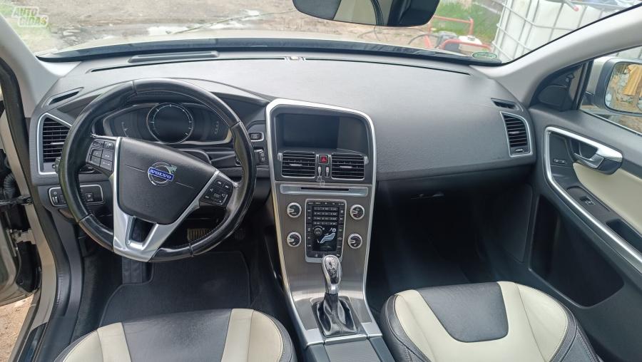 Brown Volvo XC60 2015 in Alytus, with an engine capacity of 2.00 L and mileage of 303 thousand km for 10499 €, photo 9 on AUTOMOTO.COM.LV