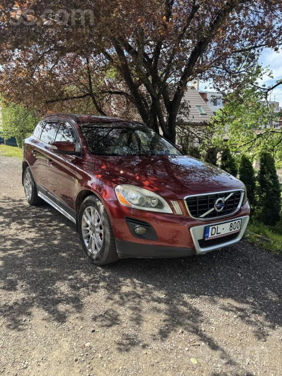 Red Volvo XC60 2009 in Cesis, with an engine capacity of 2.40 L and mileage of 300 thousand km for 7400 €, photo 1 on AUTOMOTO.COM.LV