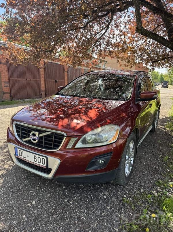 Red Volvo XC60 2009 in Cesis, with an engine capacity of 2.40 L and mileage of 300 thousand km for 7400 €, photo 2 on AUTOMOTO.COM.LV