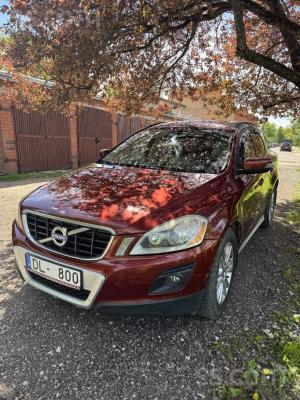Red Volvo XC60 2009 in Cesis, with an engine capacity of 2.40 L and mileage of 300 thousand km for 7400 €, photo 3 on AUTOMOTO.COM.LV