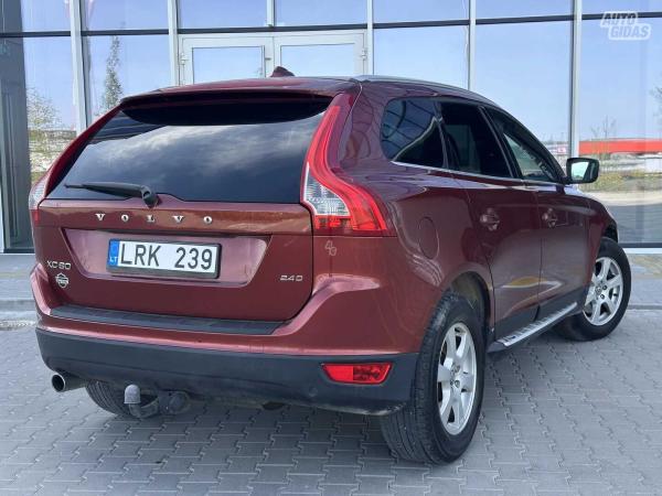 Red Volvo XC60 2010 in Vilnius, with an engine capacity of 2.40 L and mileage of 277 thousand km for 6800 €, photo 6 on AUTOMOTO.COM.LV