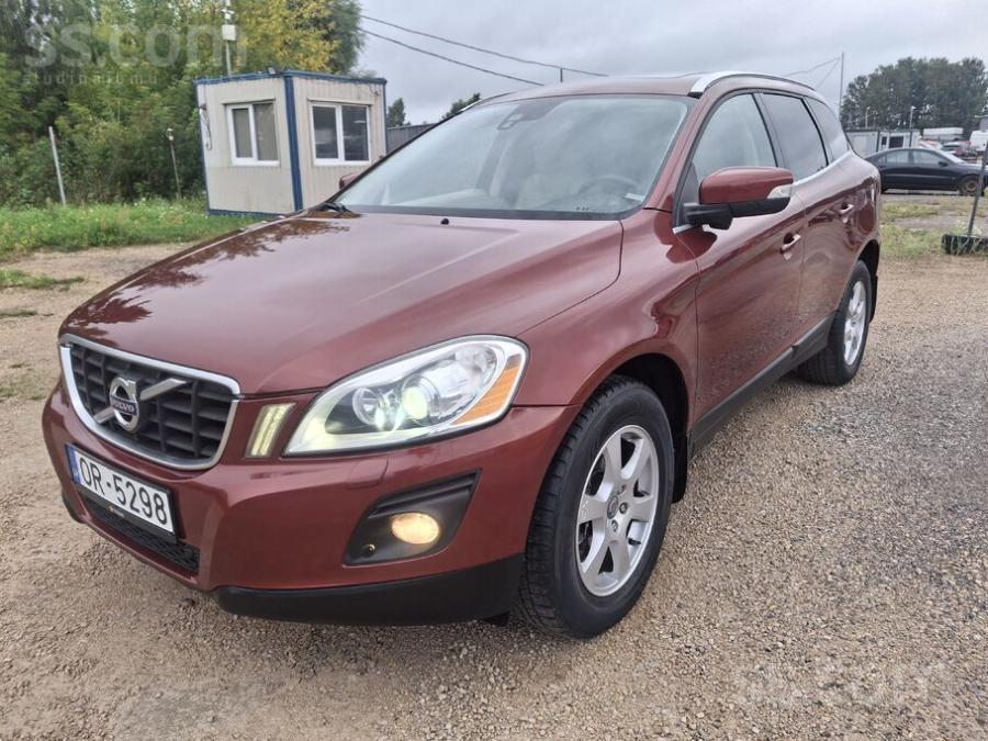 Red Volvo XC60 2010 in Riga, with an engine capacity of 2.40 L and mileage of 306 thousand km for 8495 €, photo 1 on AUTOMOTO.COM.LV