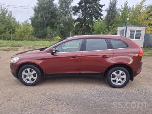 Red Volvo XC60 2010 in Riga, with an engine capacity of 2.40 L and mileage of 306 thousand km for 8495 €, photo 3 on AUTOMOTO.COM.LV