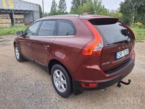 Red Volvo XC60 2010 in Riga, with an engine capacity of 2.40 L and mileage of 306 thousand km for 8495 €, photo 4 on AUTOMOTO.COM.LV
