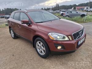 Red Volvo XC60 2010 in Riga, with an engine capacity of 2.40 L and mileage of 306 thousand km for 8495 €, photo 5 on AUTOMOTO.COM.LV