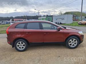 Red Volvo XC60 2010 in Riga, with an engine capacity of 2.40 L and mileage of 306 thousand km for 8495 €, photo 6 on AUTOMOTO.COM.LV