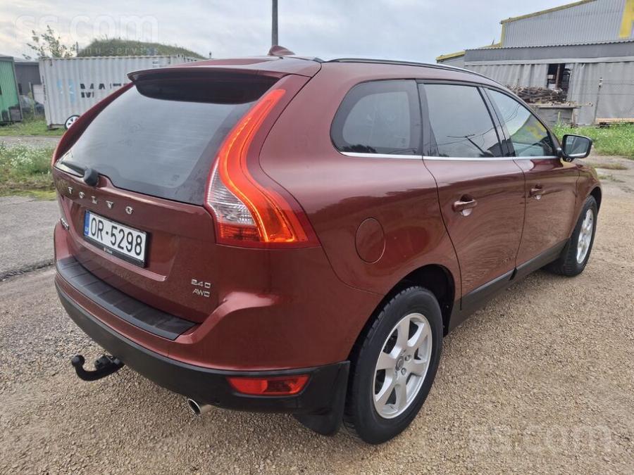 Red Volvo XC60 2010 in Riga, with an engine capacity of 2.40 L and mileage of 306 thousand km for 8495 €, photo 7 on AUTOMOTO.COM.LV