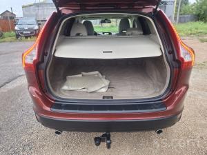 Red Volvo XC60 2010 in Riga, with an engine capacity of 2.40 L and mileage of 306 thousand km for 8495 €, photo 12 on AUTOMOTO.COM.LV