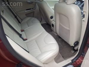 Red Volvo XC60 2010 in Riga, with an engine capacity of 2.40 L and mileage of 306 thousand km for 8495 €, photo 14 on AUTOMOTO.COM.LV