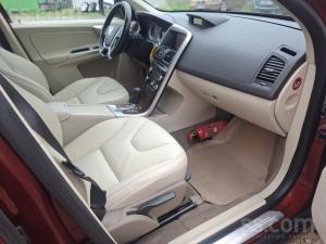Red Volvo XC60 2010 in Riga, with an engine capacity of 2.40 L and mileage of 306 thousand km for 8495 €, photo 15 on AUTOMOTO.COM.LV