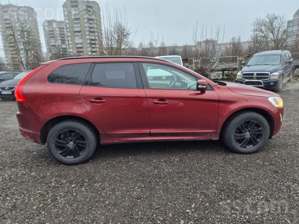 Red Volvo XC60 2014 in Riga, with an engine capacity of 2.00 L and mileage of 306 thousand km for 9990 €, photo 5 on AUTOMOTO.COM.LV