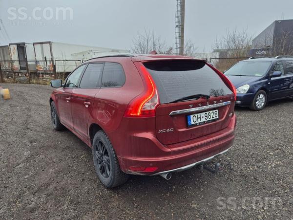 Red Volvo XC60 2014 in Riga, with an engine capacity of 2.00 L and mileage of 306 thousand km for 9990 €, photo 8 on AUTOMOTO.COM.LV