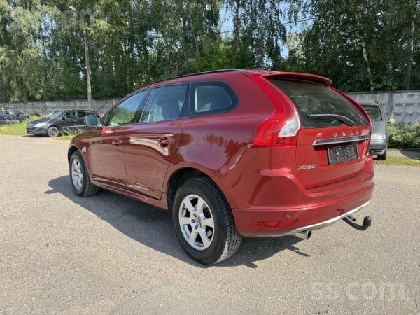 Red Volvo XC60 2015 in Riga, with an engine capacity of 2.00 L and mileage of 290 thousand km for 10580 €, photo 3 on AUTOMOTO.COM.LV