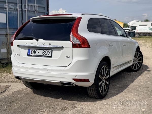 White Volvo XC60 2014 in Riga, with an engine capacity of 2.00 L and mileage of 255 thousand km for 11995 €, photo 5 on AUTOMOTO.COM.LV