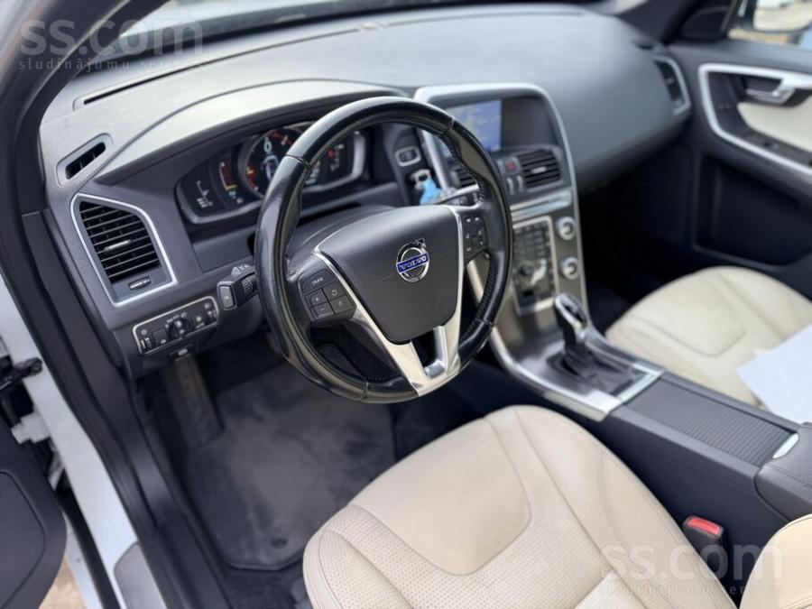 White Volvo XC60 2014 in Riga, with an engine capacity of 2.00 L and mileage of 255 thousand km for 11995 €, photo 11 on AUTOMOTO.COM.LV