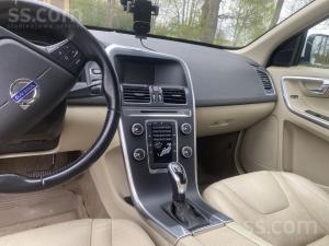 White Volvo XC60 2014 in Riga, with an engine capacity of 2.00 L and mileage of 270 thousand km for 9000 €, photo 14 on AUTOMOTO.COM.LV