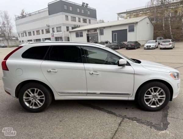 White Volvo XC60 2015 in Alytus, with an engine capacity of 2.00 L and mileage of 200 thousand km for 11800 €, photo 6 on AUTOMOTO.COM.LV