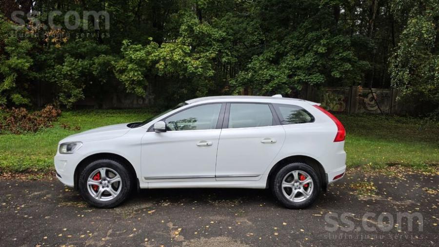 White Volvo XC60 2015 in Riga, with an engine capacity of 2.00 L and mileage of 300 thousand km for 7000 €, photo 7 on AUTOMOTO.COM.LV
