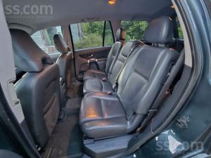 Blue Volvo XC90 2007 in Talsi, with an engine capacity of 2.40 L and mileage of 282 thousand km for 6999 €, photo 23 on AUTOMOTO.COM.LV