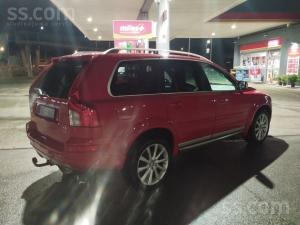 Red Volvo XC90 2012 in Riga, with an engine capacity of 2.40 L and mileage of 0 thousand km for 9990 €, photo 2 on AUTOMOTO.COM.LV